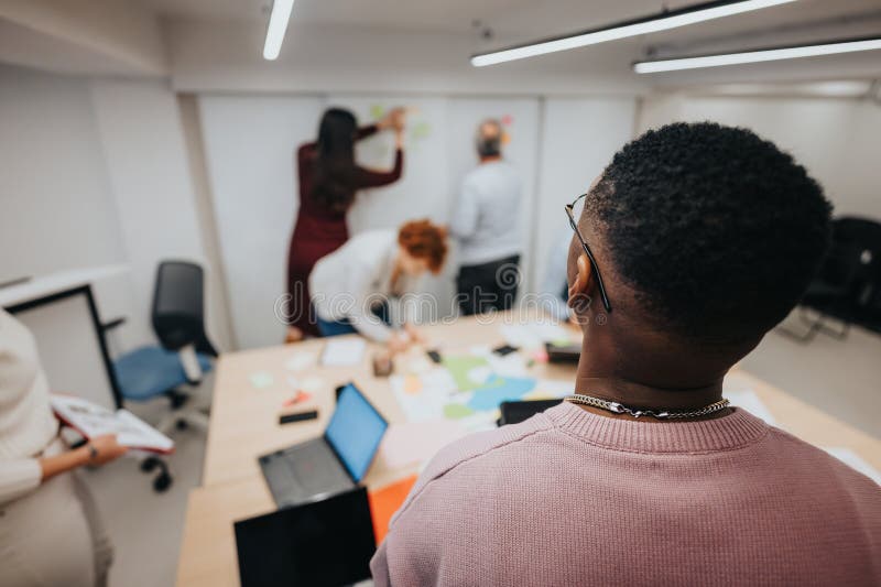 Diverse Professionals Collaborating, Analyzing Stats, Discussing ...