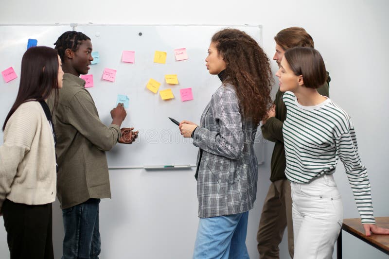 Business Team Discussing Sticky Notes on the Wall. Stock Photo - Image ...