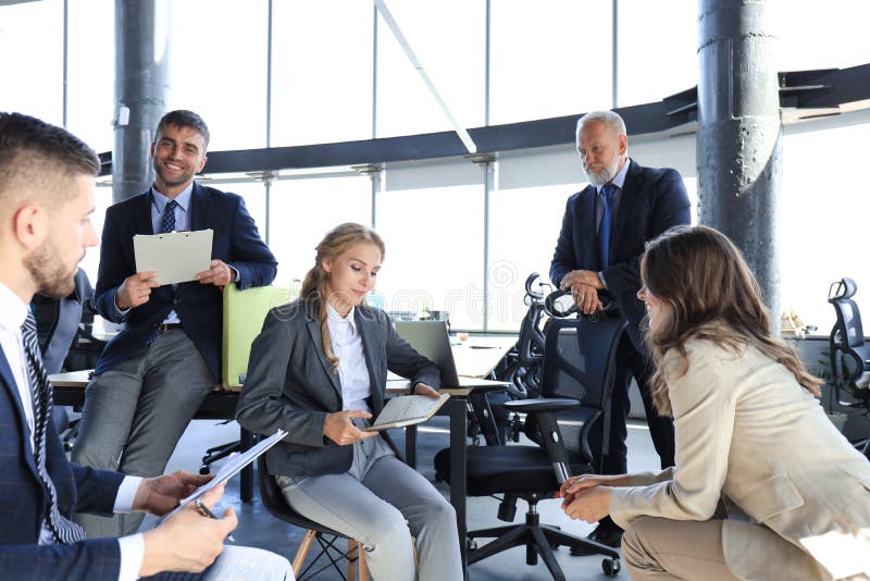 Business Team Discussing Together Business Plans in Office Stock Image ...