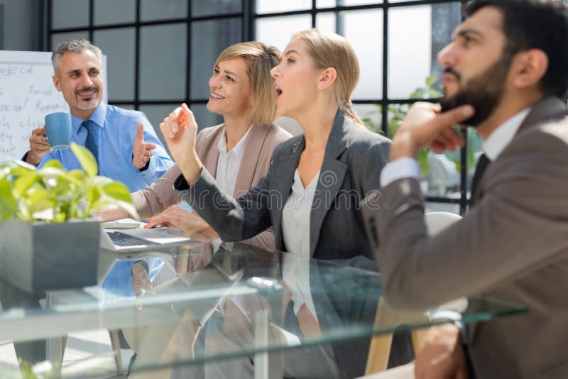 Business Team Discussing Together Business Plans in Office. Stock Photo ...