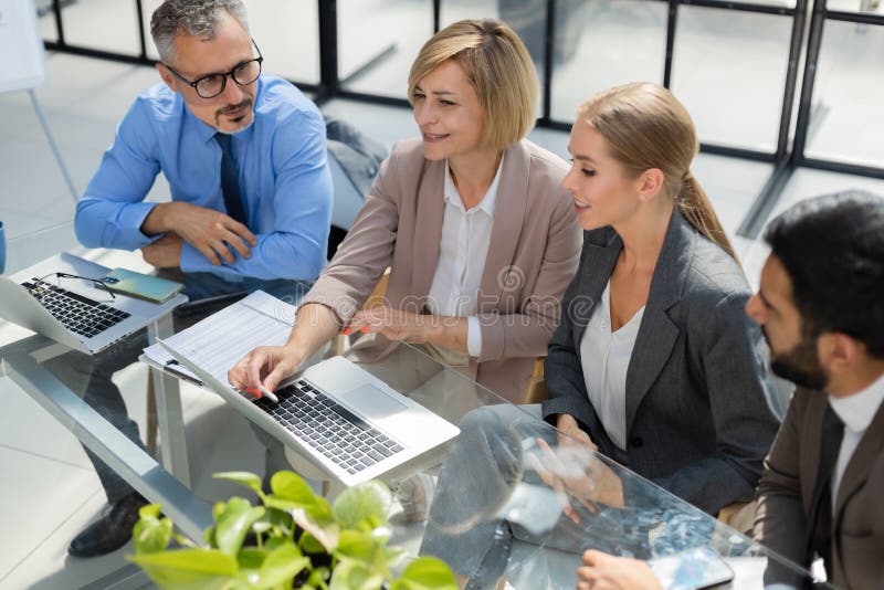 Business Team Discussing Together Business Plans in Office. Stock Photo ...