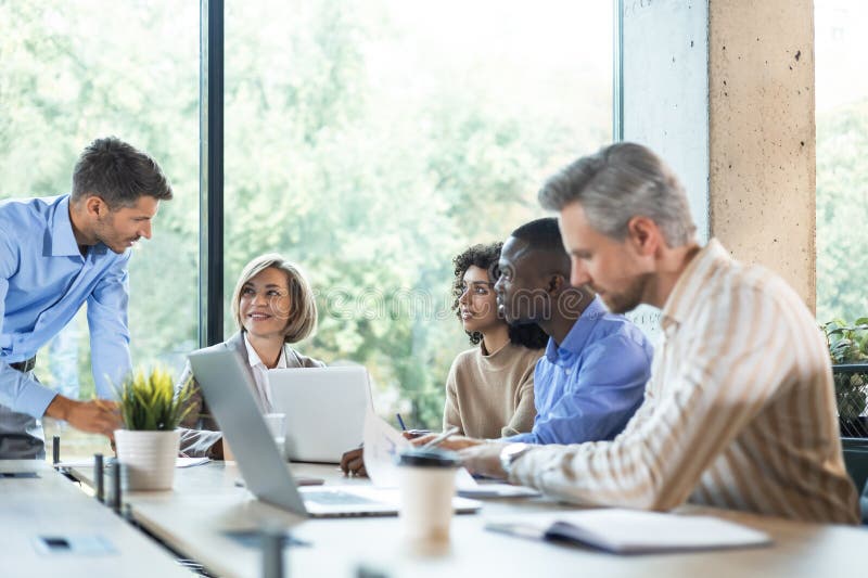 Business Team Discussing Together Business Plans in Office. Stock Image ...