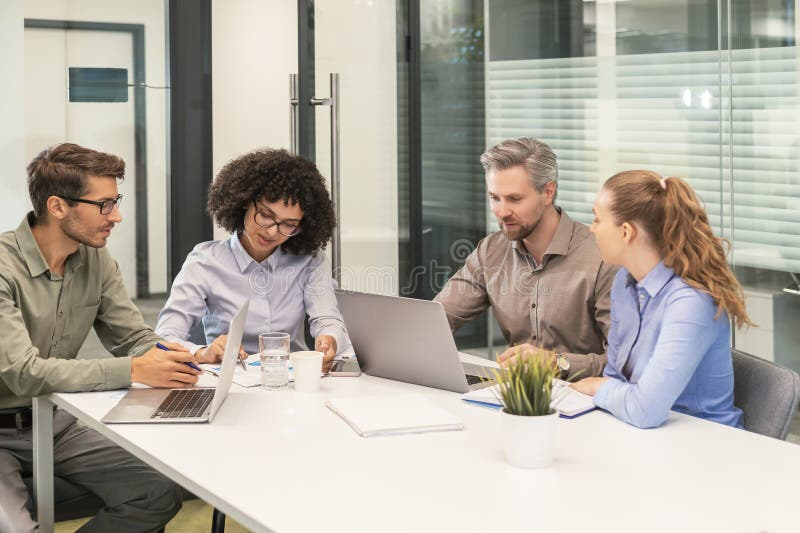 Business Team Discussing Together Business Plans in Office. Stock Image ...