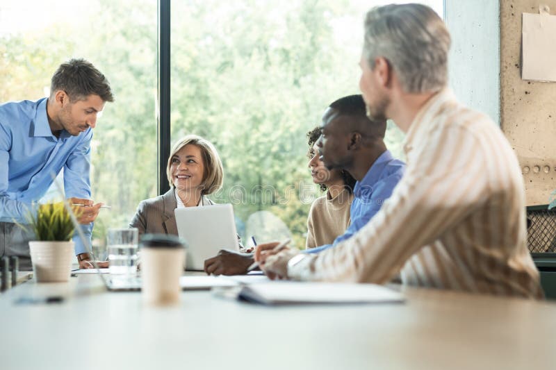 Business Team Discussing Together Business Plans in Office. Stock Photo ...