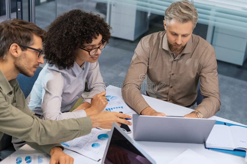 Business Team Discussing Together Business Plans in Office. Stock Photo ...
