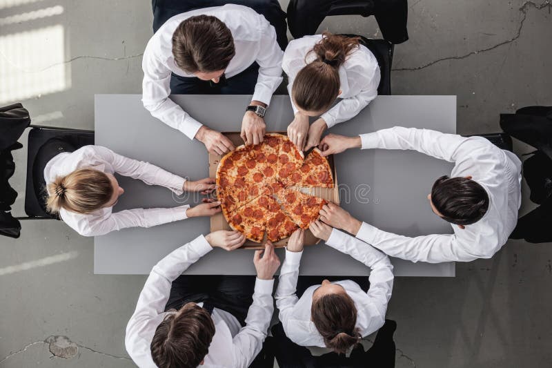 Business team eating pizza stock photo. Image of lunch - 71465490