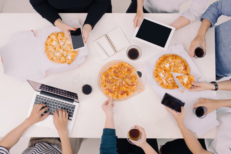 Business Team is Eating Pizza at Work while Working Stock Image - Image ...
