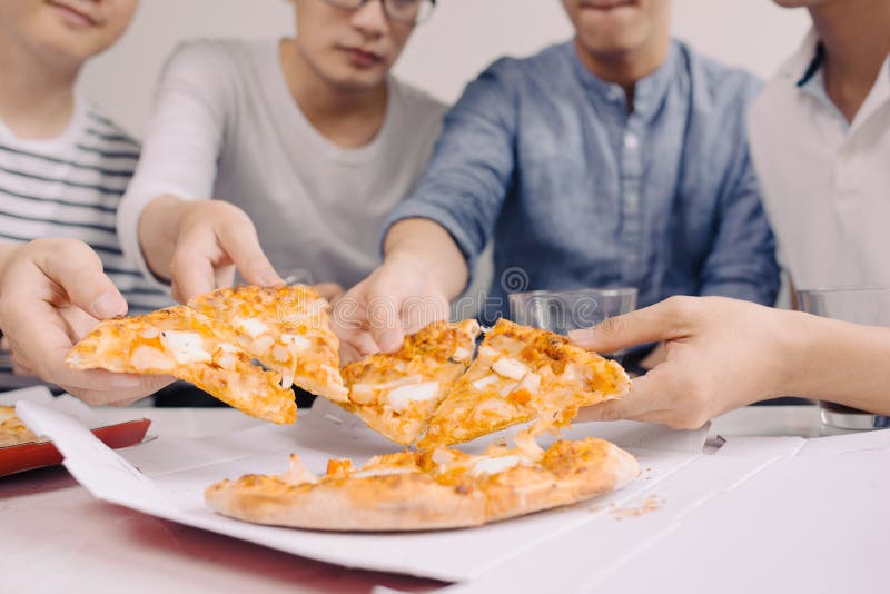 Business Team is Eating Pizza at Work while Working Stock Image - Image ...