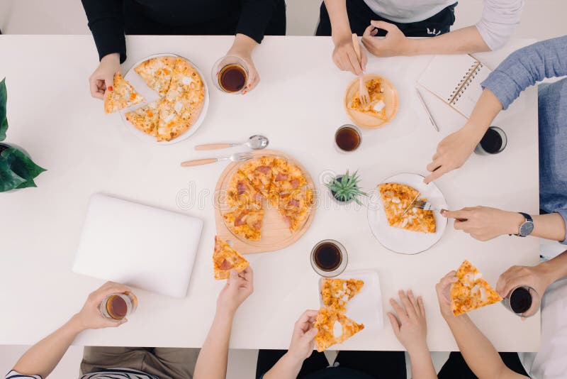 Business Team is Eating Pizza at Work while Working Stock Photo - Image ...