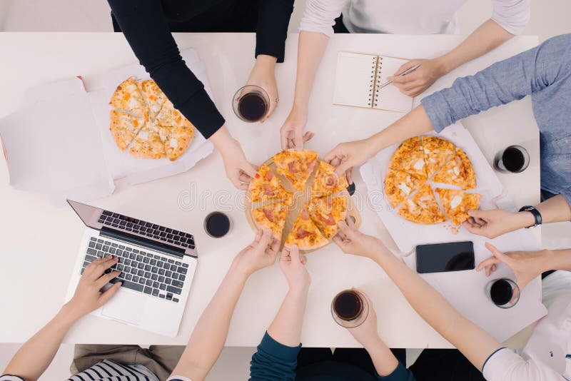 Business Team is Eating Pizza at Work while Working Stock Image - Image ...