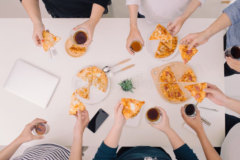 Business Team is Eating Pizza at Work while Working Stock Image - Image ...