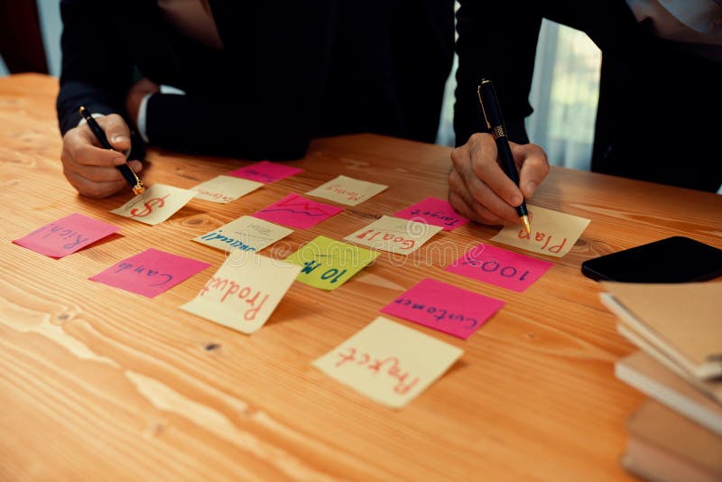 Business Team Gather on Table, Brainstorming and Writing Creative Idea ... Business Team Gather on Table, Brainstorming and Writing Creative Idea ...