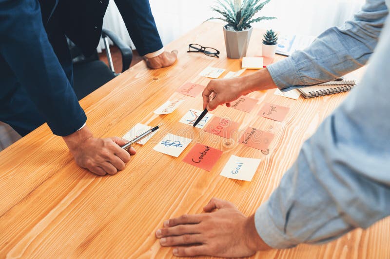 Business Team Gather on Table, Brainstorming and Writing Creative Idea ...