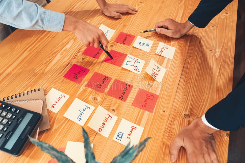 Business Team Gather on Table, Brainstorming and Writing Creative Idea ...