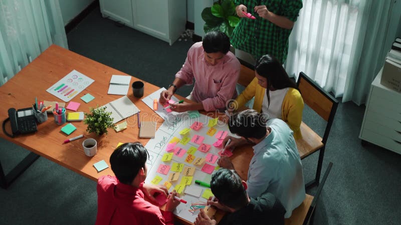 Business Team Hands Writing and Putting Sticky Note on Task Board ...