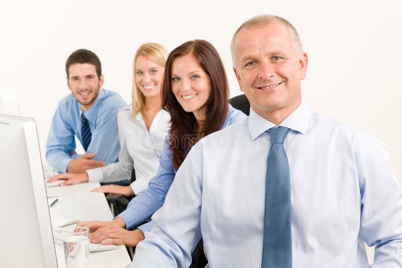 Business Team Happy Sit in Line Behind Table Stock Photo - Image of ...