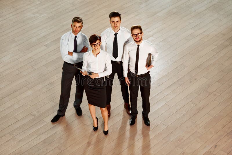 Business Team. Happy Smiling People Standing in Office Stock Photo ...