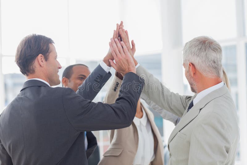 Business team high fiving stock image. Image of businesswoman - 31447727