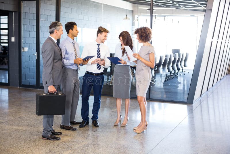Business Team Interacting in Office Stock Photo - Image of cheerful ...