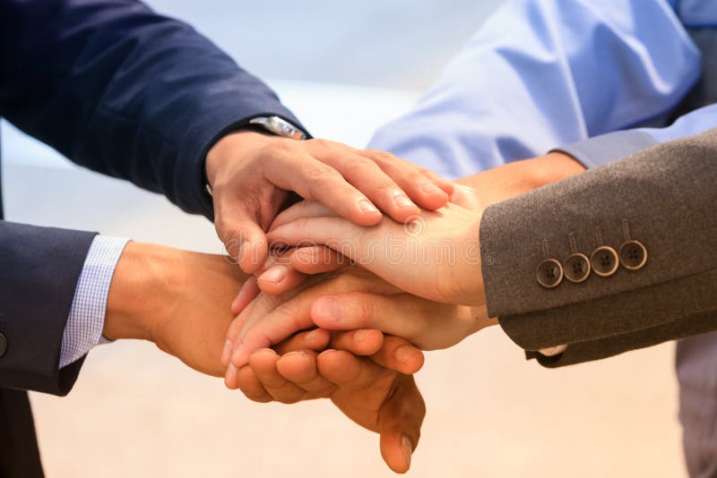 Teamwork Concept,Business Team Joining Hands Holding Together Stock ...