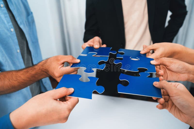 Business Team Joining Jigsaw Puzzle Together. Prudent Stock Photo ...
