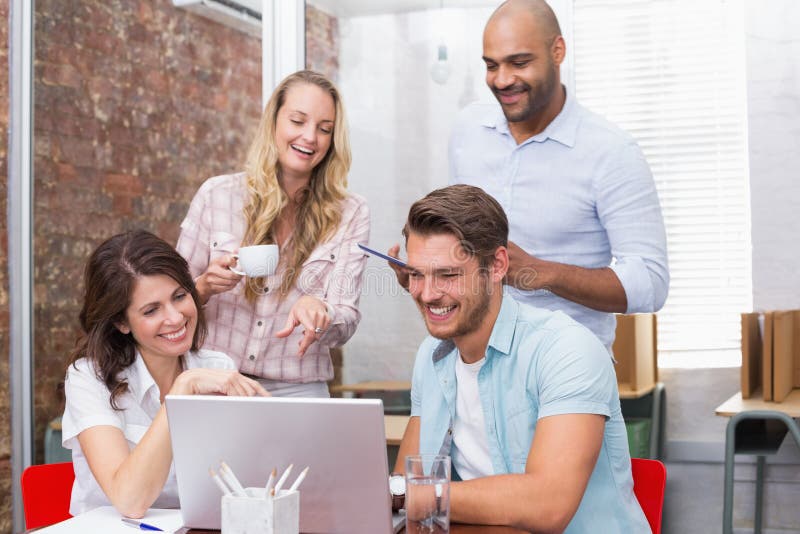 Business Team Laughing Together in Front of the Laptop Stock Image ...