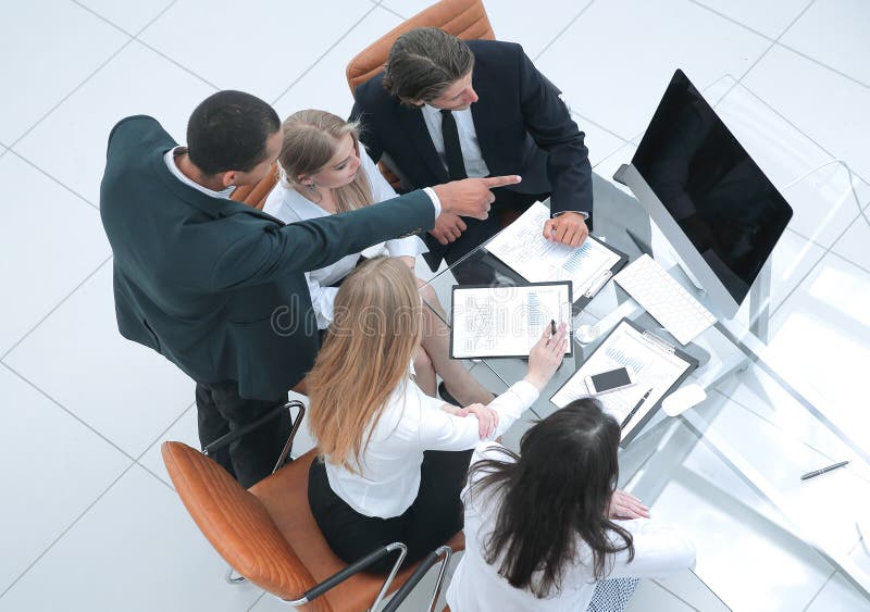 Business Team Looking at Documents in the Office with the Manager ...