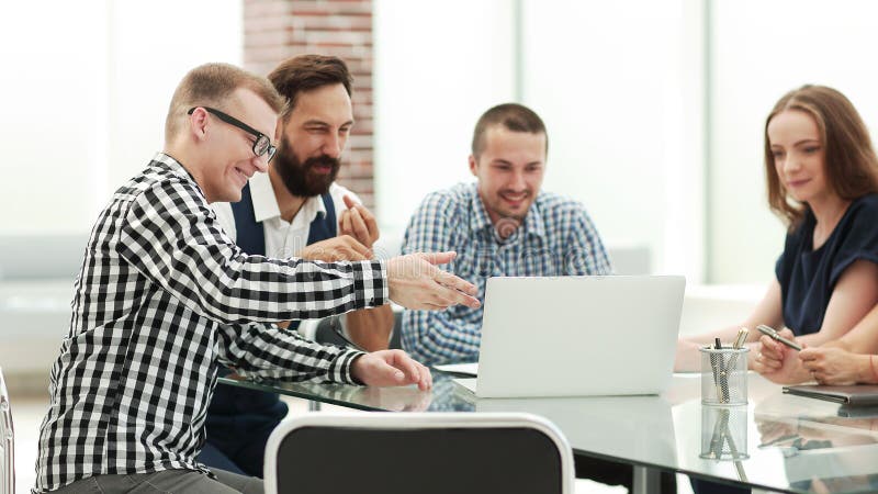 Business Team Looking at the Laptop Screen and Discussing Their Ideas ...