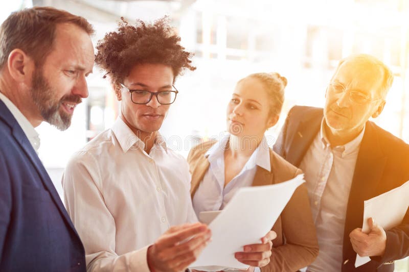 Business Team Looks at Annual Report or Business Plan Stock Image ...
