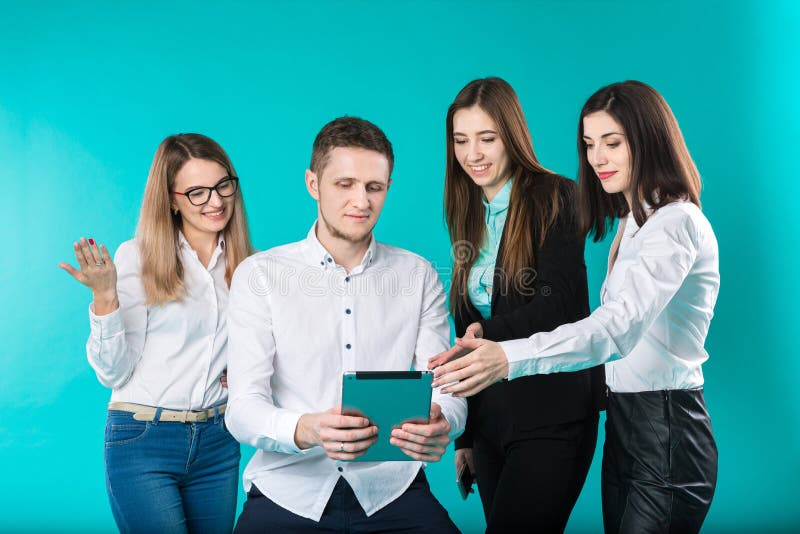 Business Team Looks at the Digital Tablet Screen. Business People Using ...