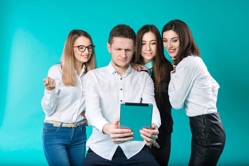 Business Team Looks at the Digital Tablet Screen. Business People Using ...