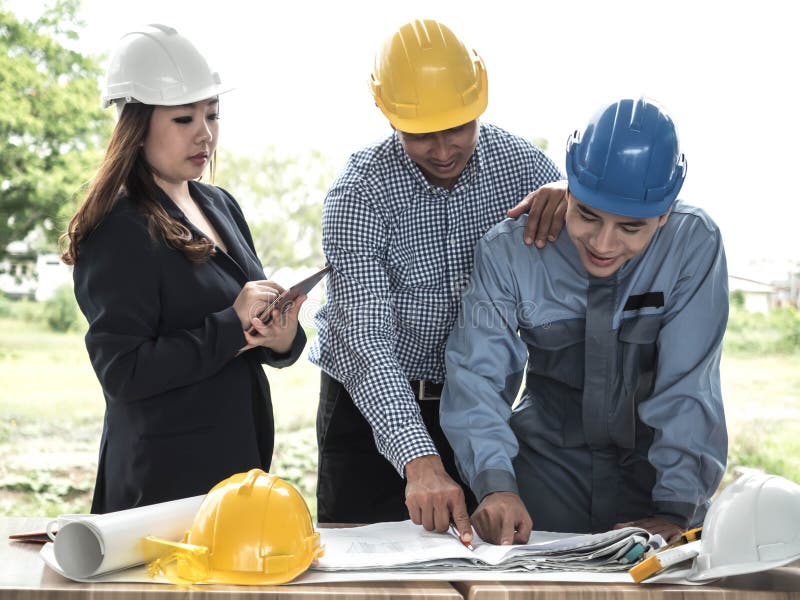 Business Team Making a Structure with Wooden Cubes. Building a Business ...