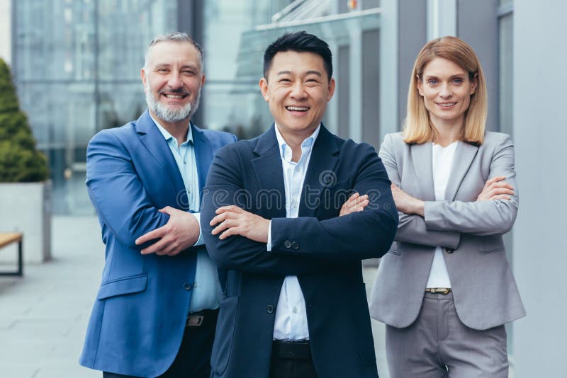 Business Team, Male and Female Colleagues in Business Attire Looking at ... Business Team, Male and Female Colleagues in Business Attire Looking at ...