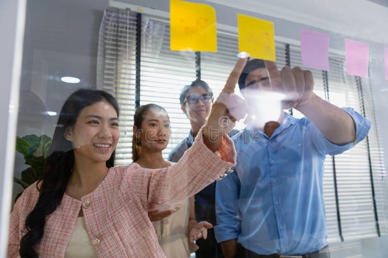 Business Team Meeting Planning New Strategy Using Colored Sticky Notes ...
