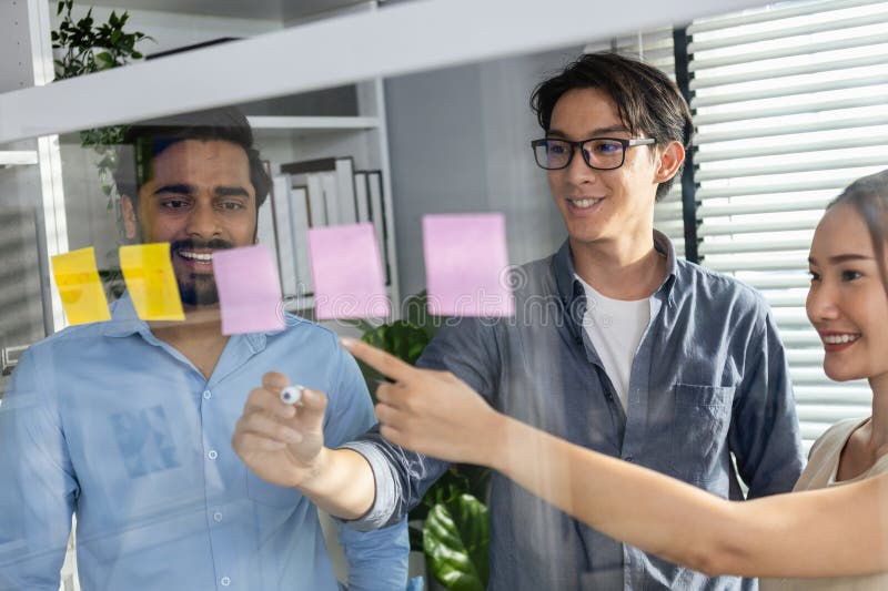 Business Team Meeting Planning New Strategy Using Colored Sticky Notes ...