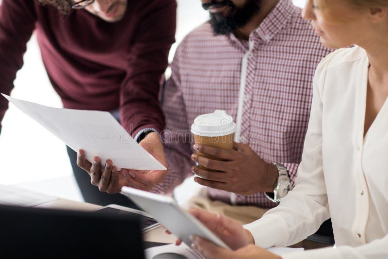 Team with Papers and Take Away Coffee on Staircase Stock Photo - Image ...