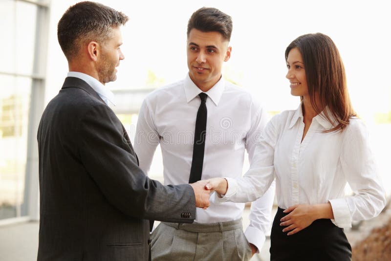 Business Team. People Shake Hands Communicating with Each Other Stock ...