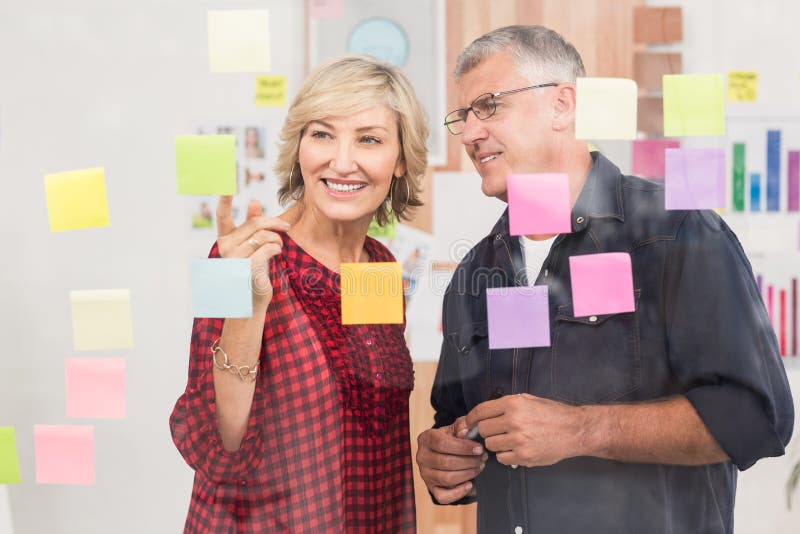 Business Team Pointing Post Its on the Wall Stock Photo - Image of cool ...