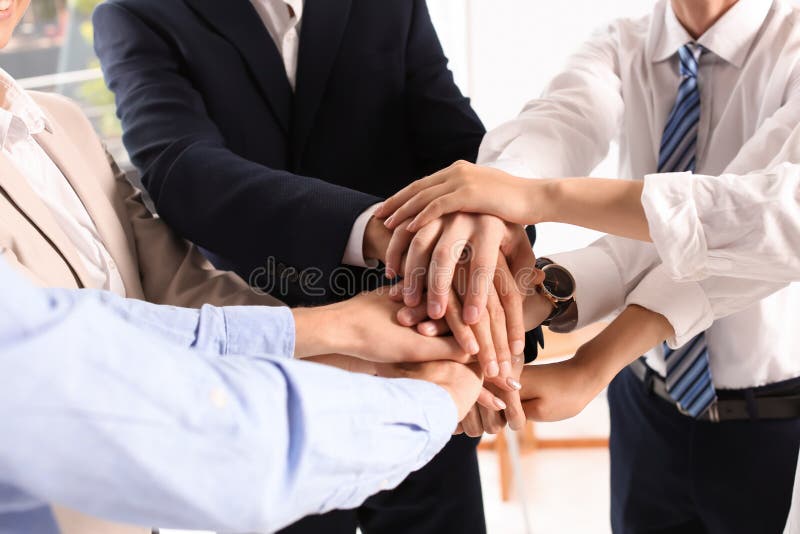 Business Team Putting Hands Together As Symbol of Unity Stock Photo ...