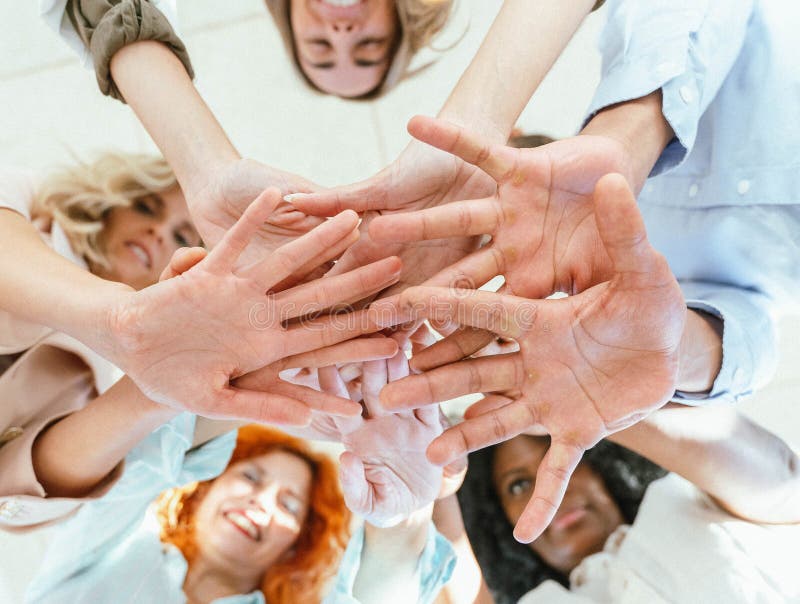 Business Team Putting Their Hands Together Showing Unity and Support ...