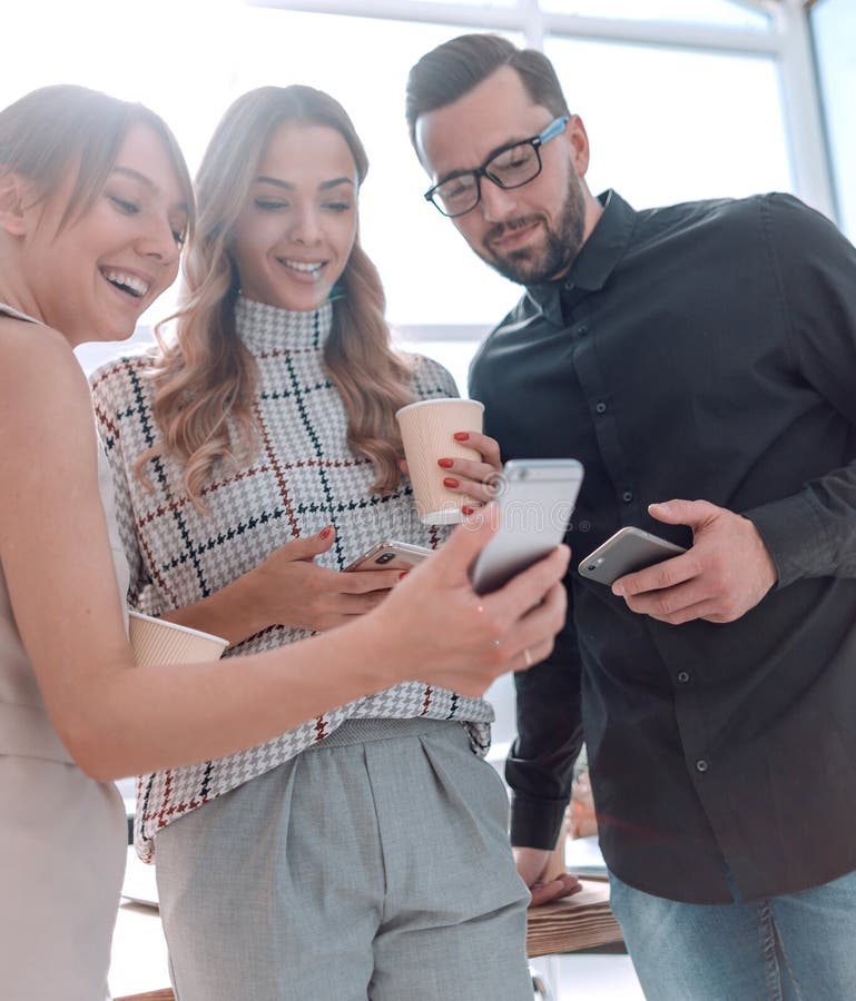 Business Team Reading Emails on Their Smartphones. Stock Image - Image ...