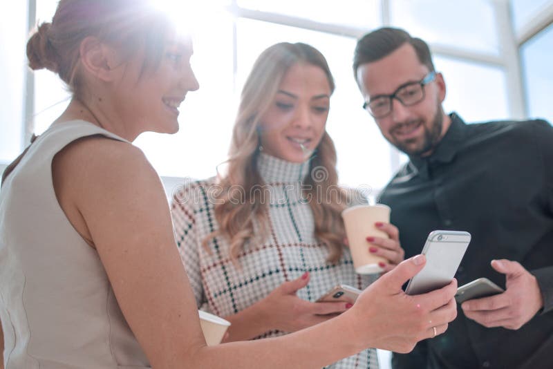Business Team Reading Emails on Their Smartphones. Stock Image - Image ...