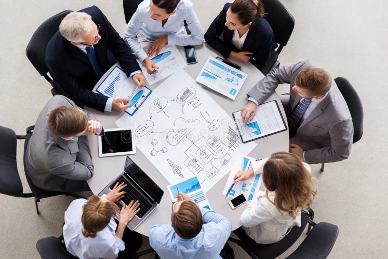 Business Team with Scheme on Flip Chart at Office Stock Image - Image ...