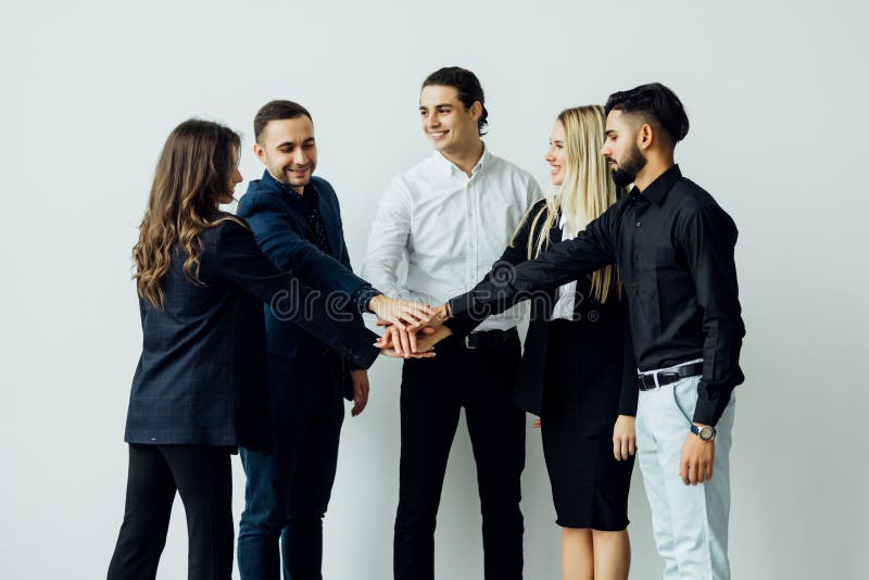 Business Team Showing Unity with Their Hands Together in the Office ...