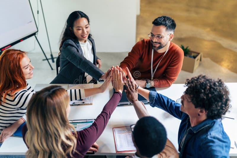 Business Team Showing Unity with Their Hands Together Stock Image ...