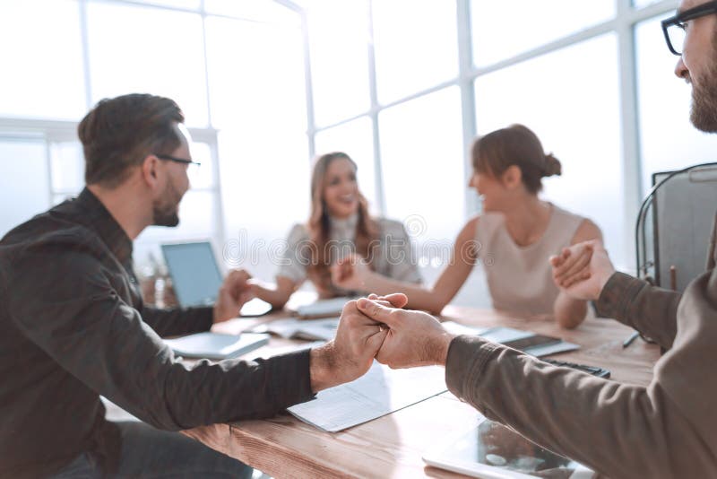 Business Team Sitting at the Table and Showing Their Unity Stock Image ...