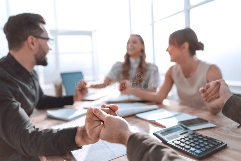 Business Team Sitting at the Table and Showing Their Unity Stock Image ...