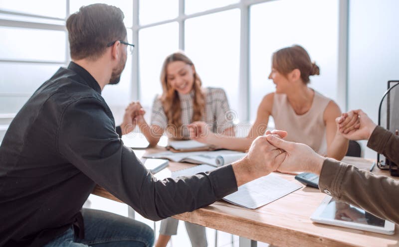 Business Team Sitting at the Table and Showing Their Unity Stock Image ...