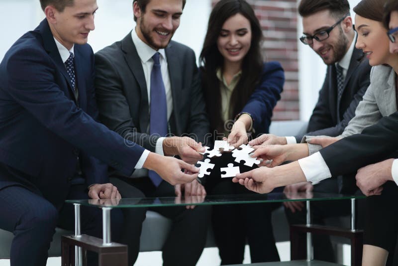 Team on puzzle pieces stock photo. Image of corporate - 18556900
