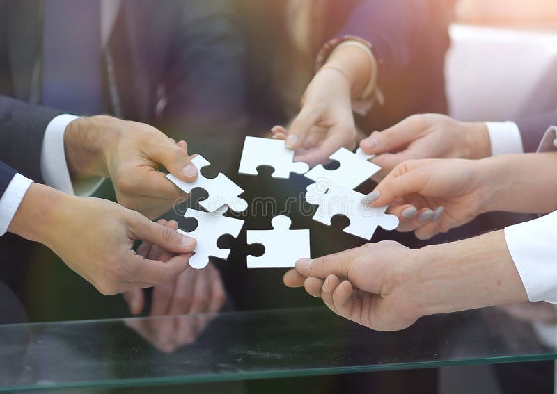 Team on puzzle pieces stock photo. Image of corporate - 18556900